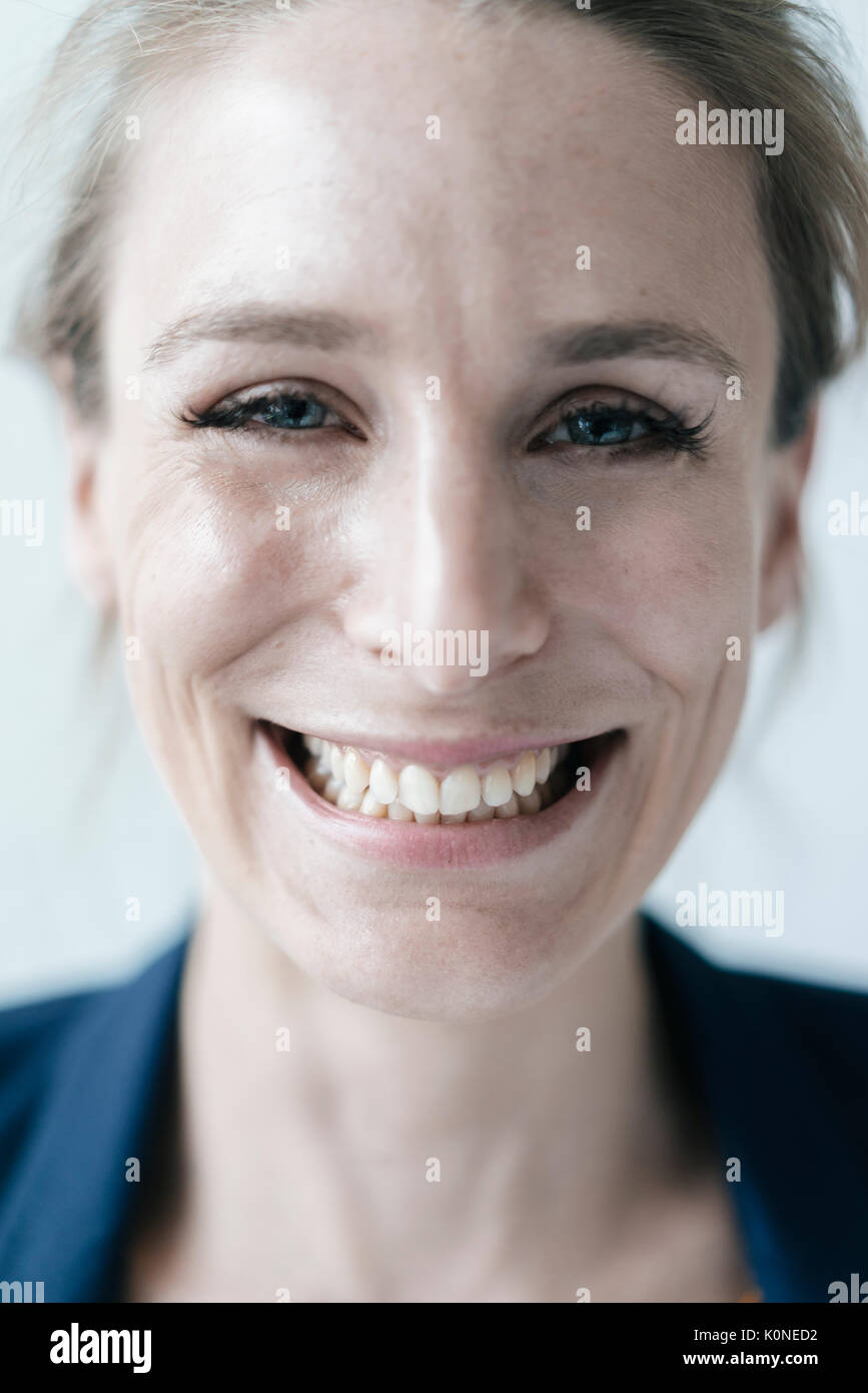 Portrait of grinning woman, close-up Stock Photo - Alamy