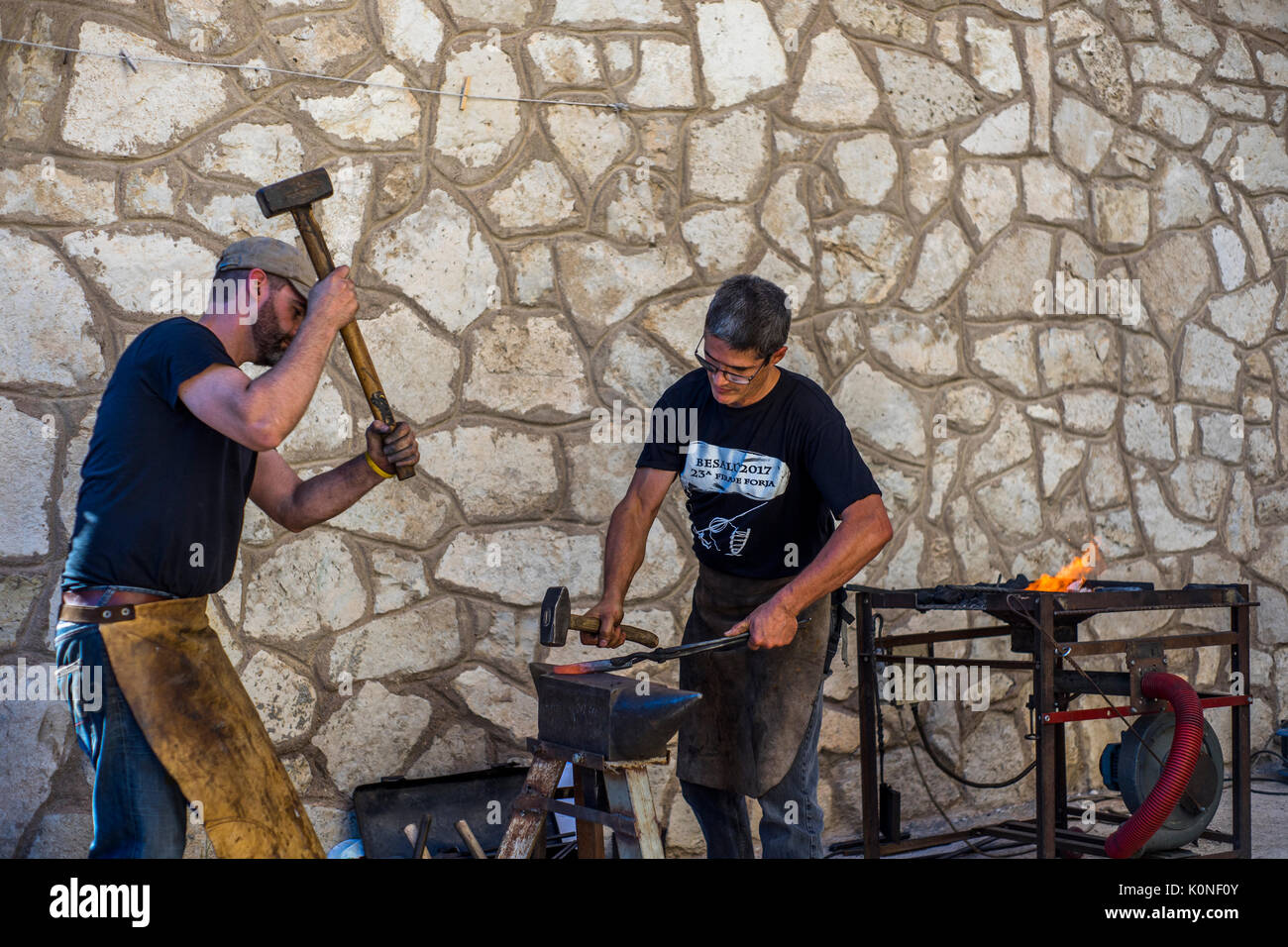 Blacksmith demonstrates his skills at a market Stock Photo - Alamy