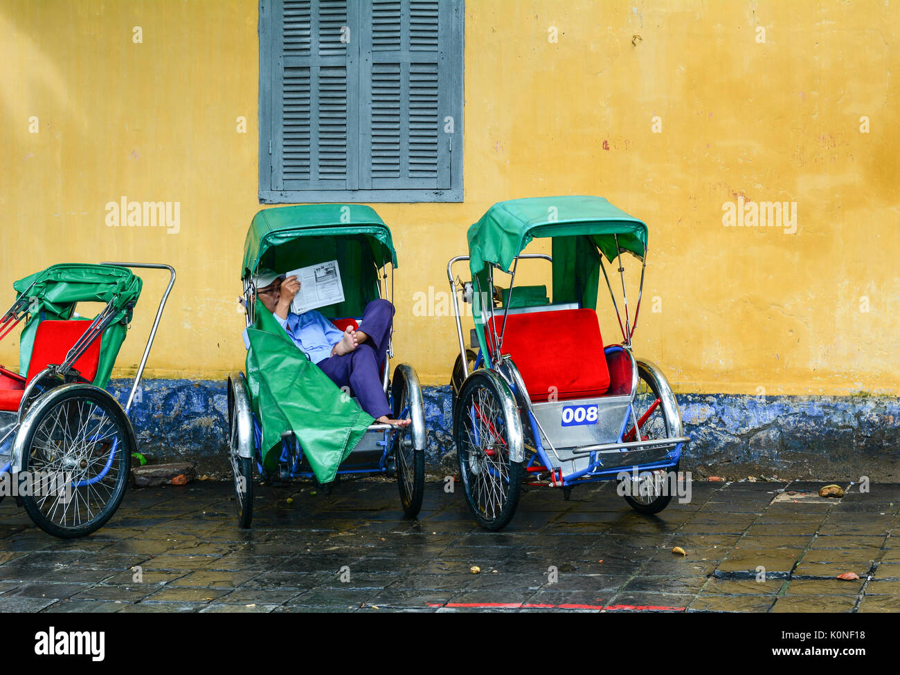 Cyclo (rickshaw) on street in Hoi An, Vietnam Stock Photo - Alamy