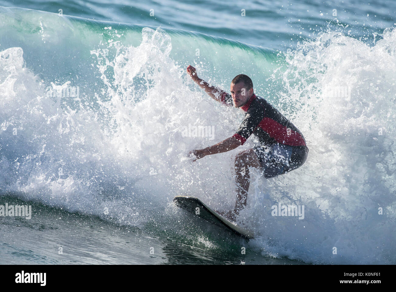 Riding a wave hi-res stock photography and images - Alamy