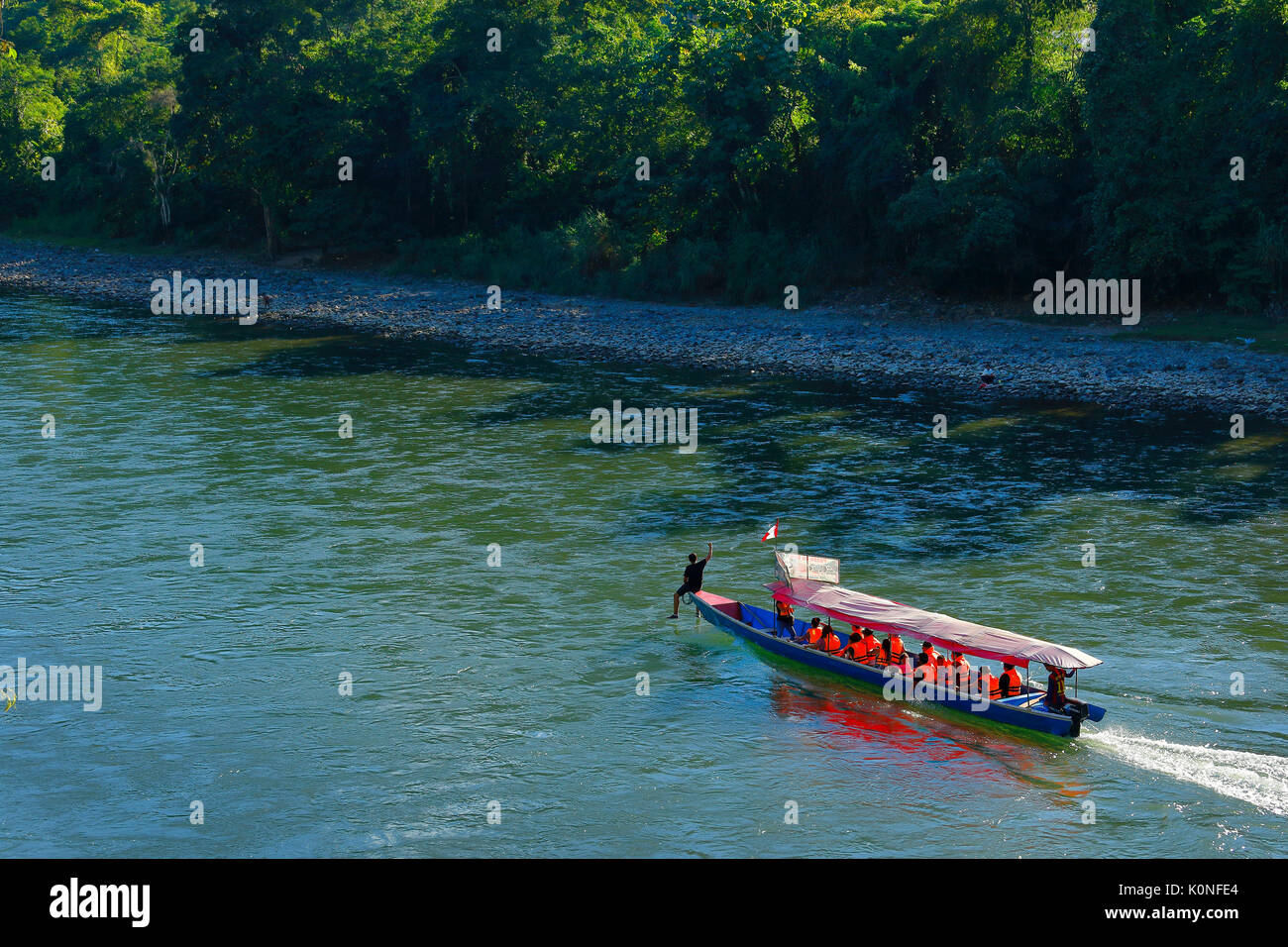 Boat sailing the river "perene Stock Photo - Alamy