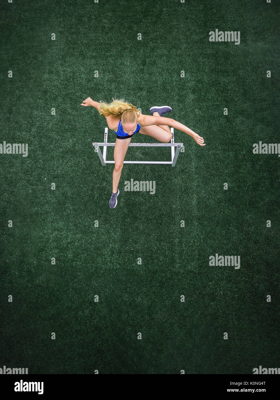 Jumping hurdler, top view Stock Photo - Alamy