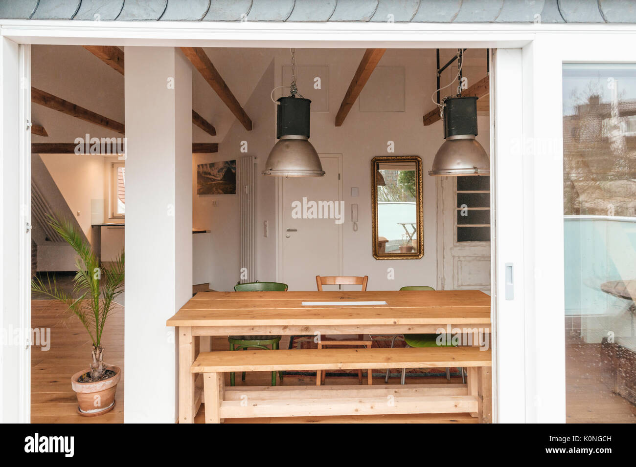 Dining area in a loft seen from terrace Stock Photo - Alamy