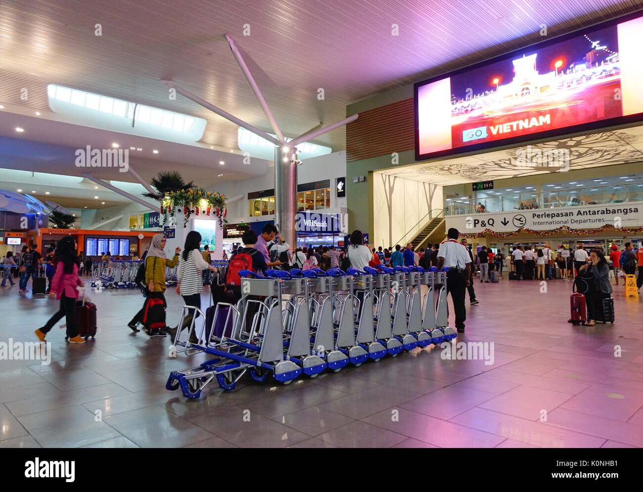 Kuala Lumpur, Malaysia - Dec 16, 2015. Trolleys at Departure Hall of ...