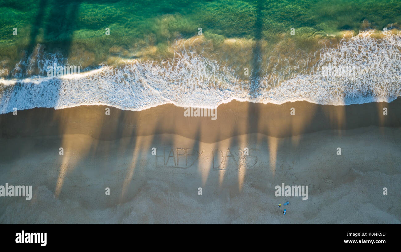 Photograph taken from above, a drone shot looking over the beach with ...