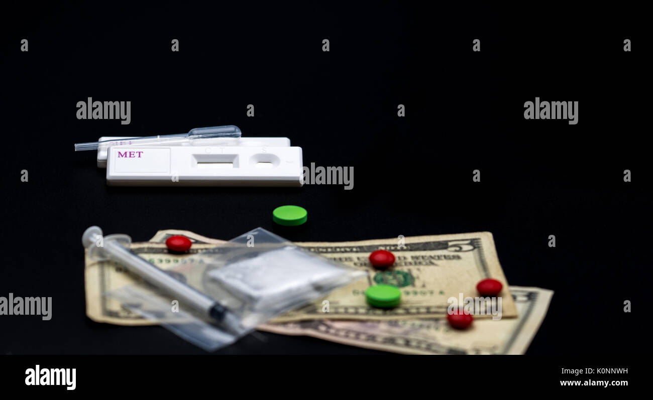 Two methamphetamine cassette test and plastic dropper with red and ...
