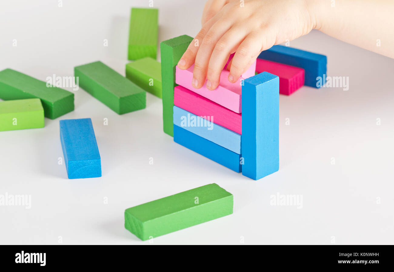 Child hands playing with colorful wooden blocks Stock Photo - Alamy