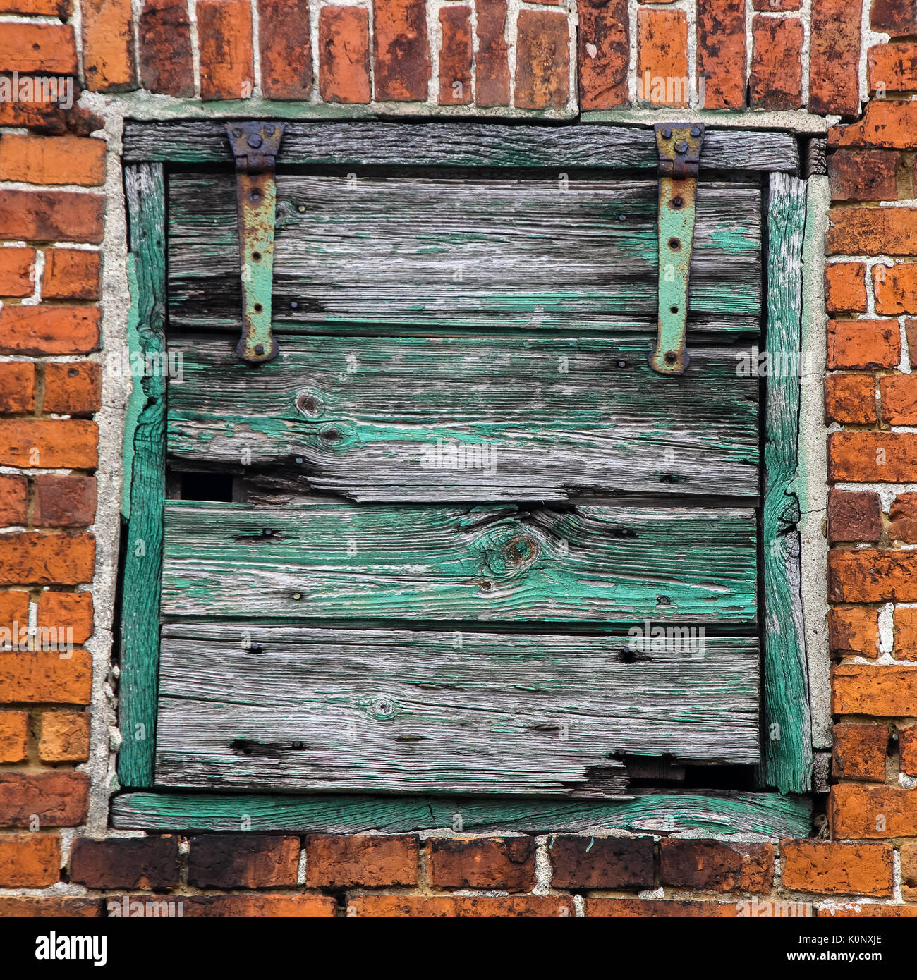 Old green wooden cracked window with rusted metallic hinge isolated ...