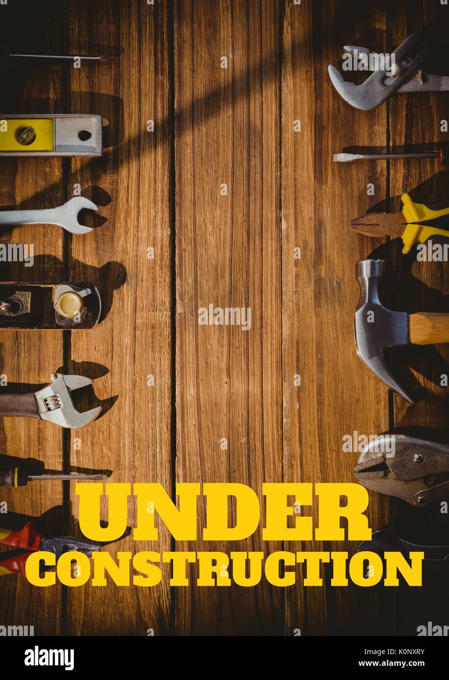 Digital composite of Under construction text against tools photo Stock ...