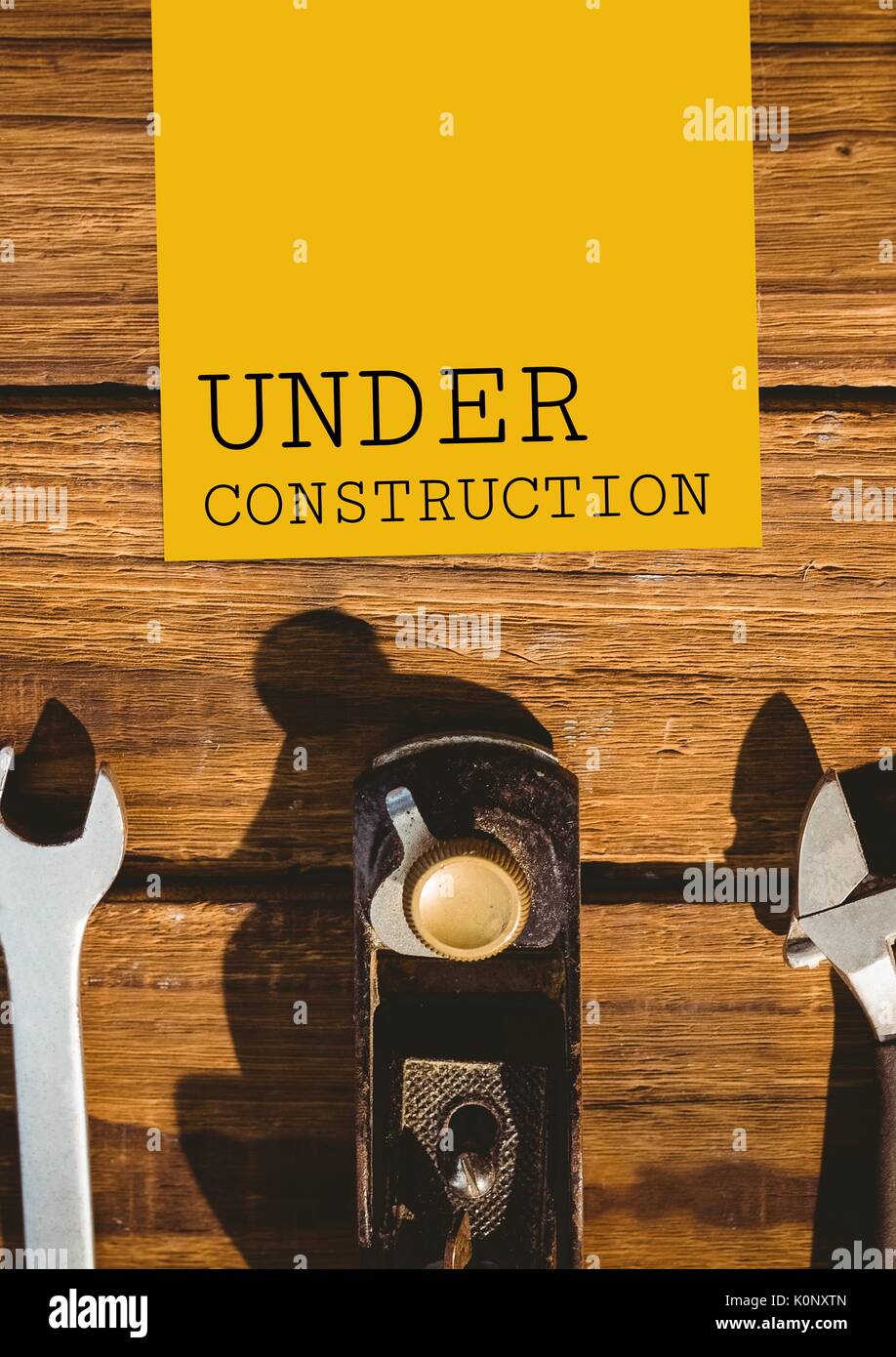 Digital composite of Under construction text against tools photo Stock ...