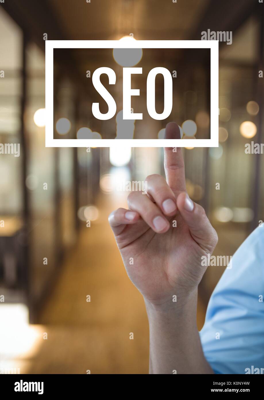 Digital composite of Hand interacting with SEO business text against ...