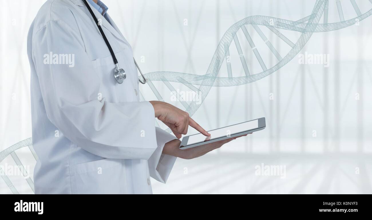 Digital composite of Doctor using a tablet with DNA strand Stock Photo ...