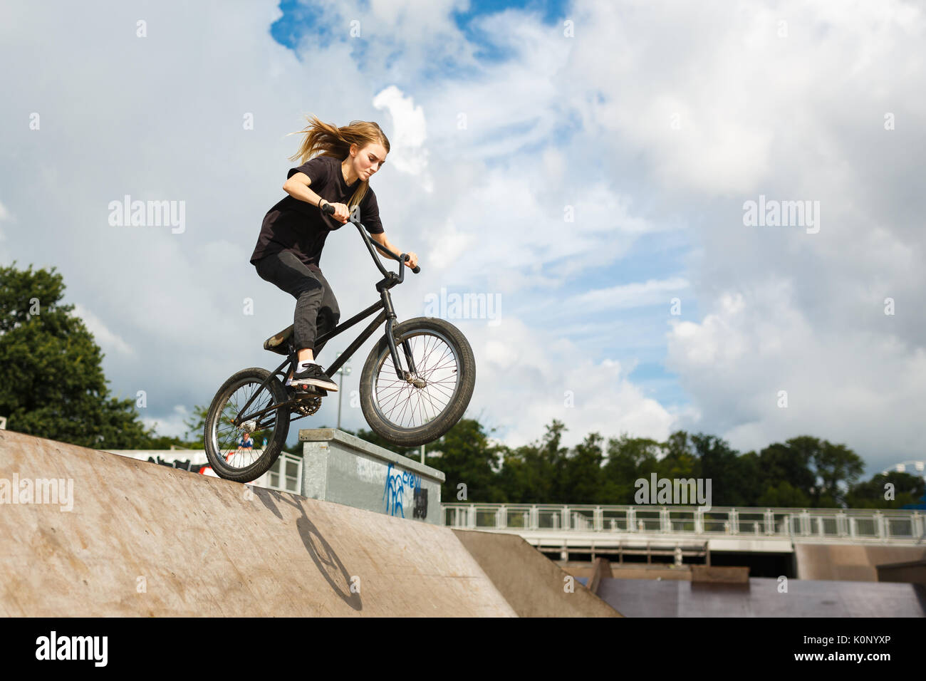 BMX rider is jumping over ramp outdoors Stock Photo - Alamy