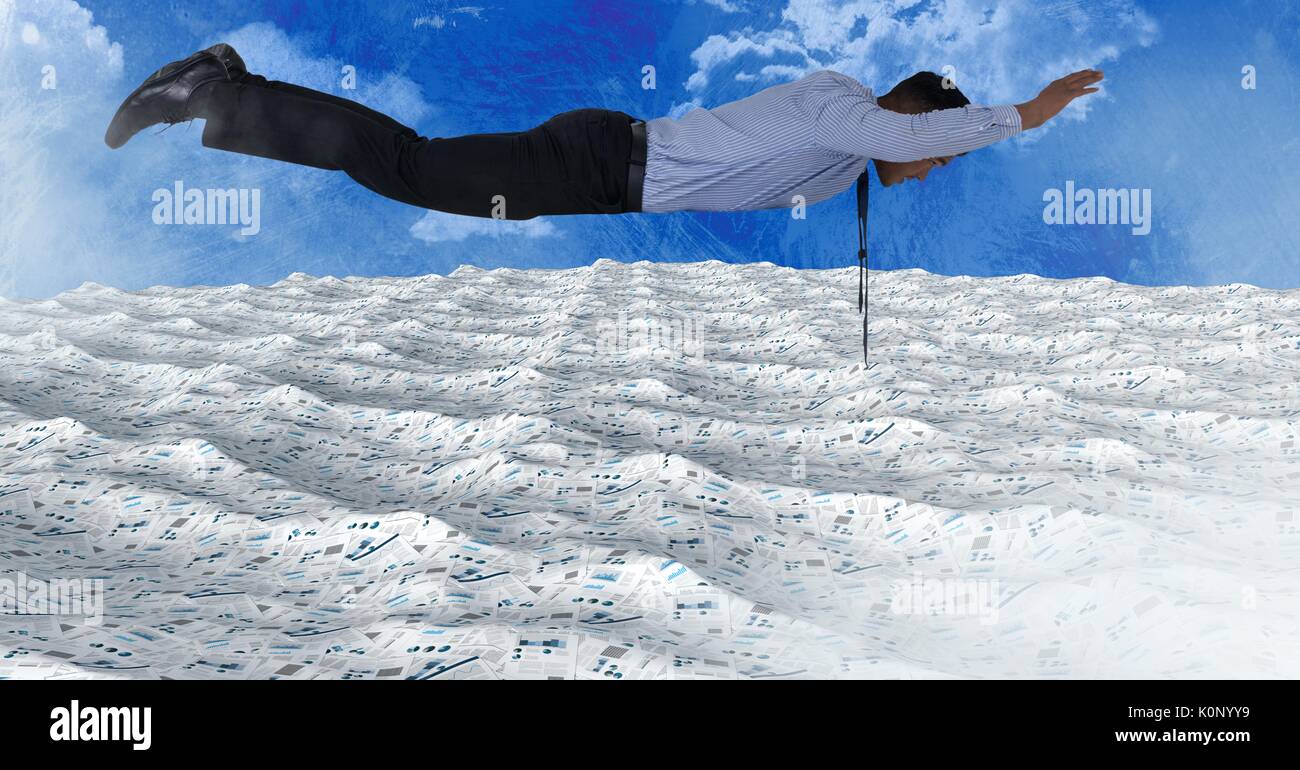 Digital composite of Businessman flying over sea of documents under sky ...