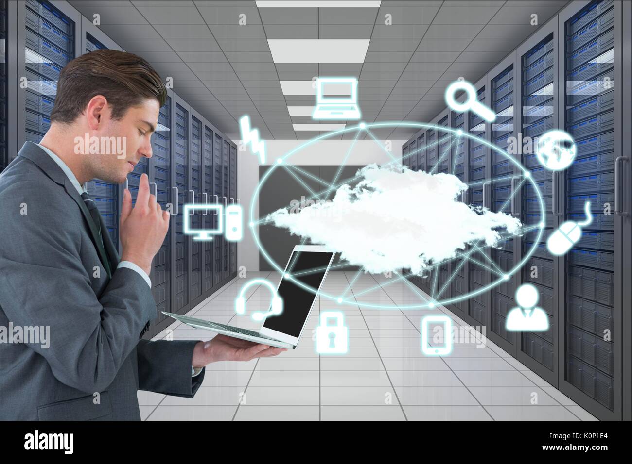 Digital composite of Business man holding a computer and graphics in ...