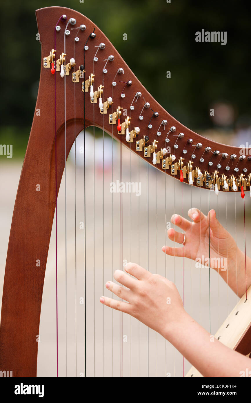 Hands on harp hi-res stock photography and images - Alamy