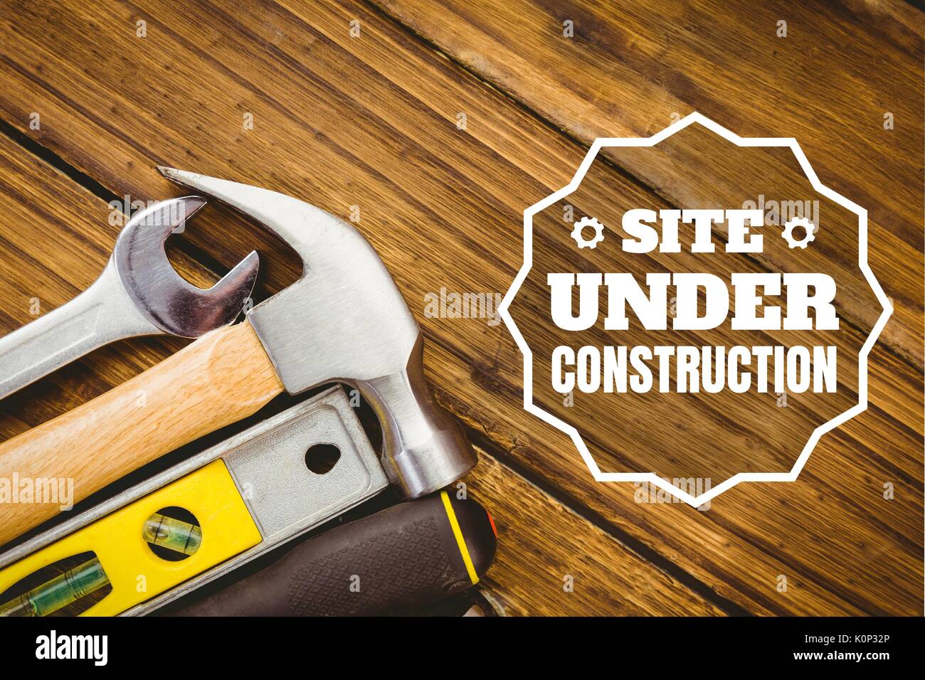 Digital composite of Website under construction text against tools ...