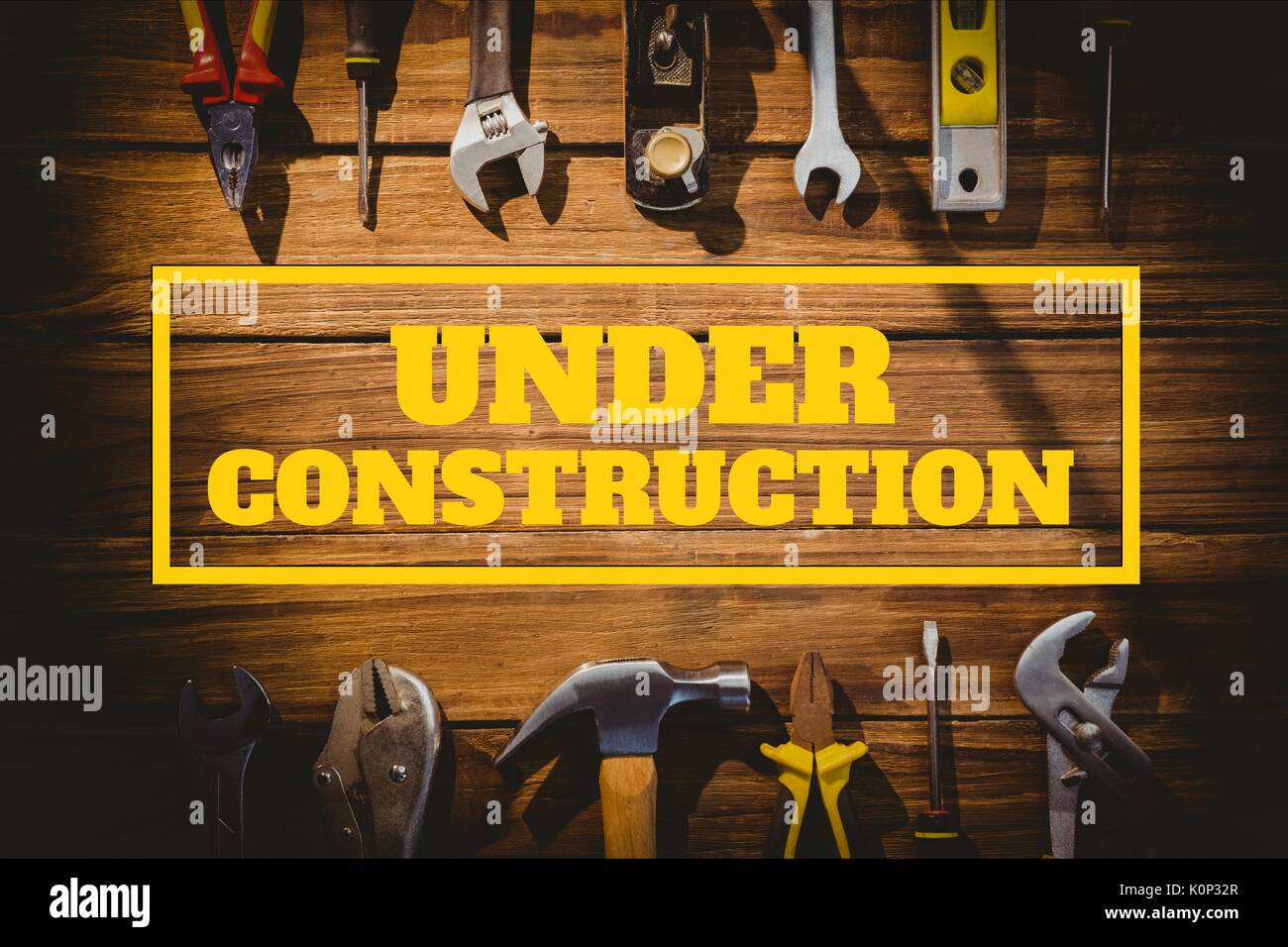 Digital composite of Under construction text against tools photo Stock ...