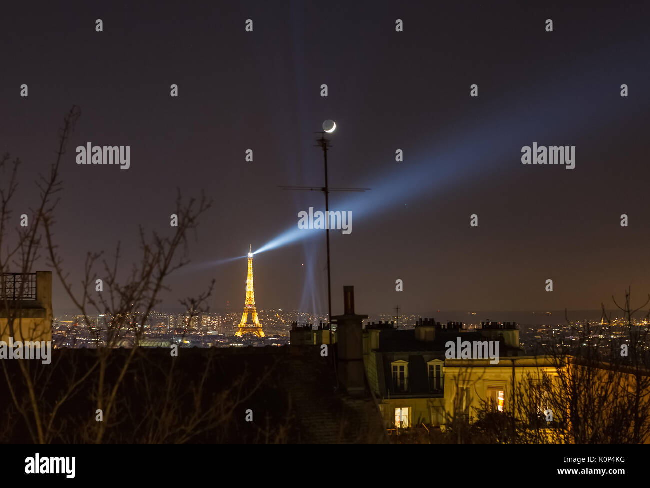 Night view on Eiffel Tower and early Moon above Paris, France Stock ...