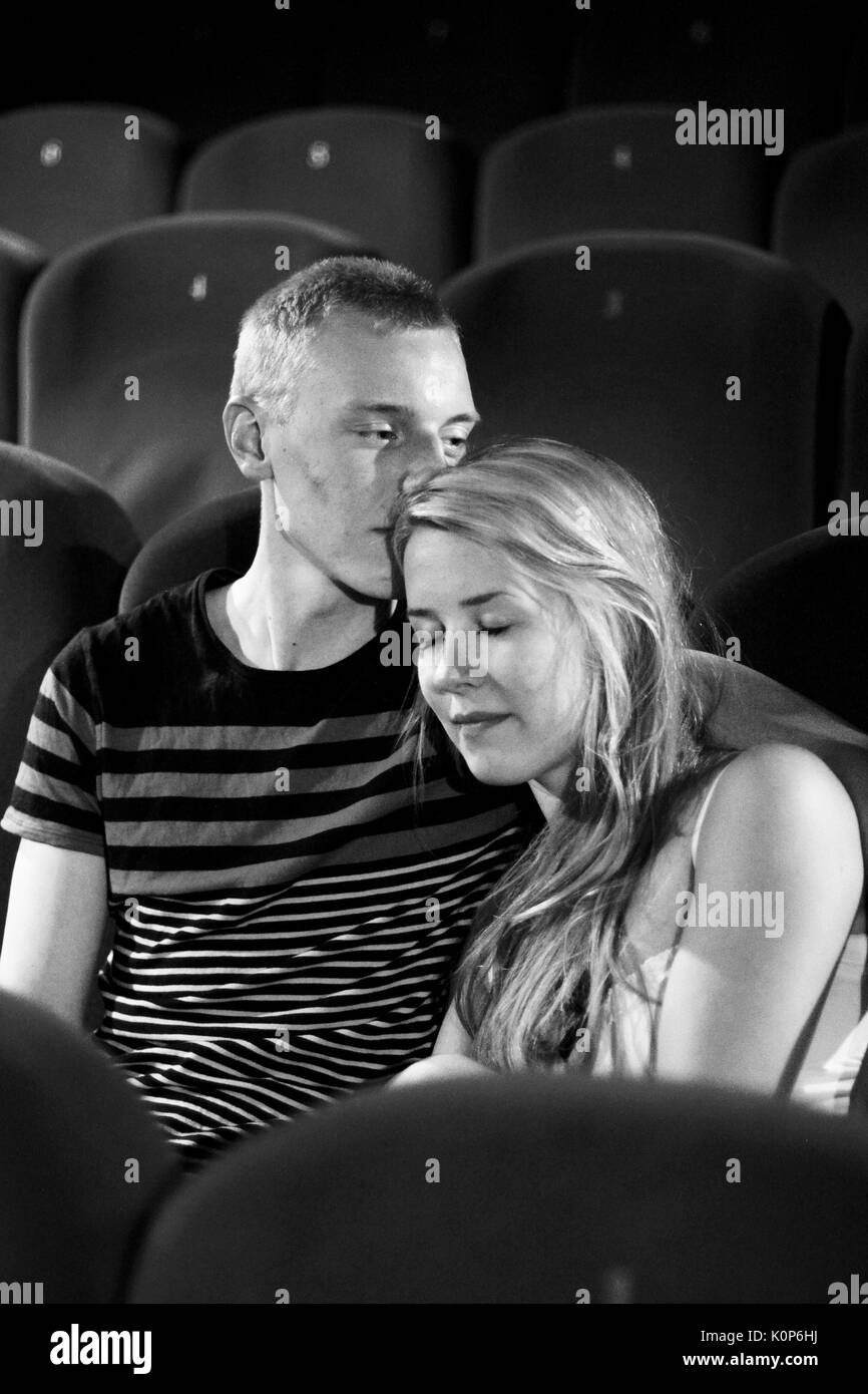 Couple on armchair cuddling hi-res stock photography and images - Alamy