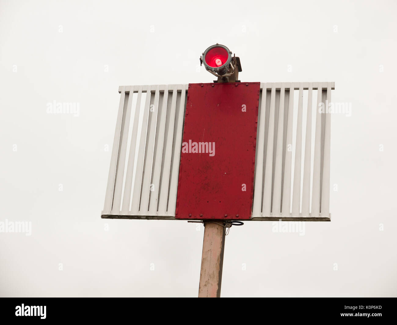 a marine seaside red and white light metal thing in sky; England; UK ...