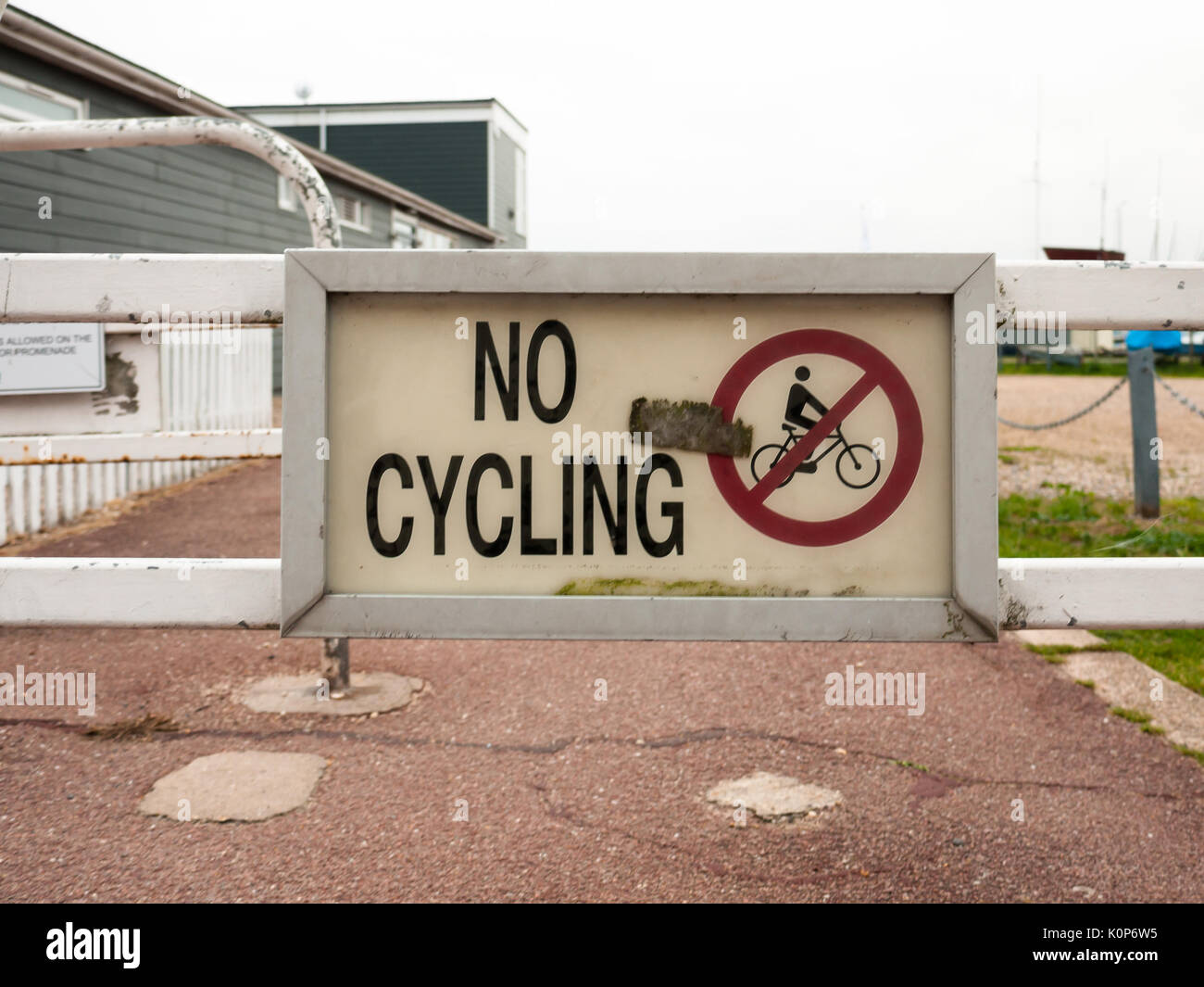 a sign on fence saying no cycling dirty; England; UK Stock Photo - Alamy