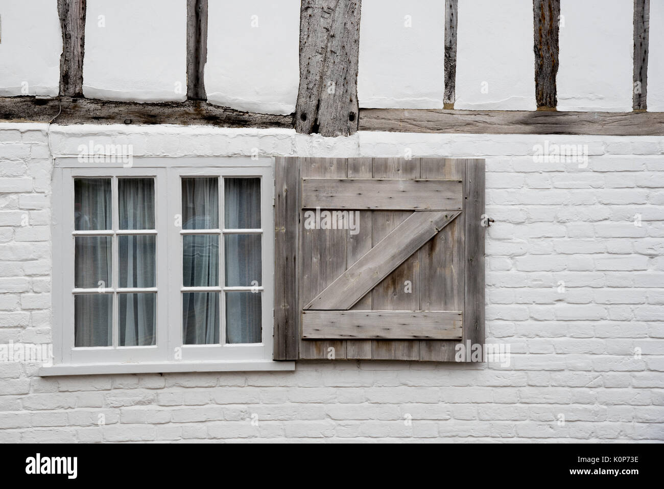 White wooden window on a traditional British house white wall Stock ...