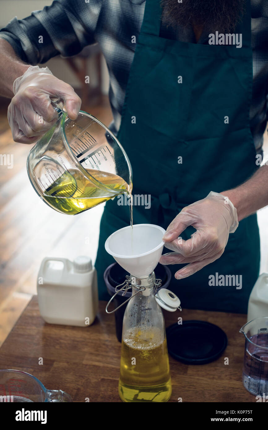 Holding funnel glass hi-res stock photography and images - Alamy