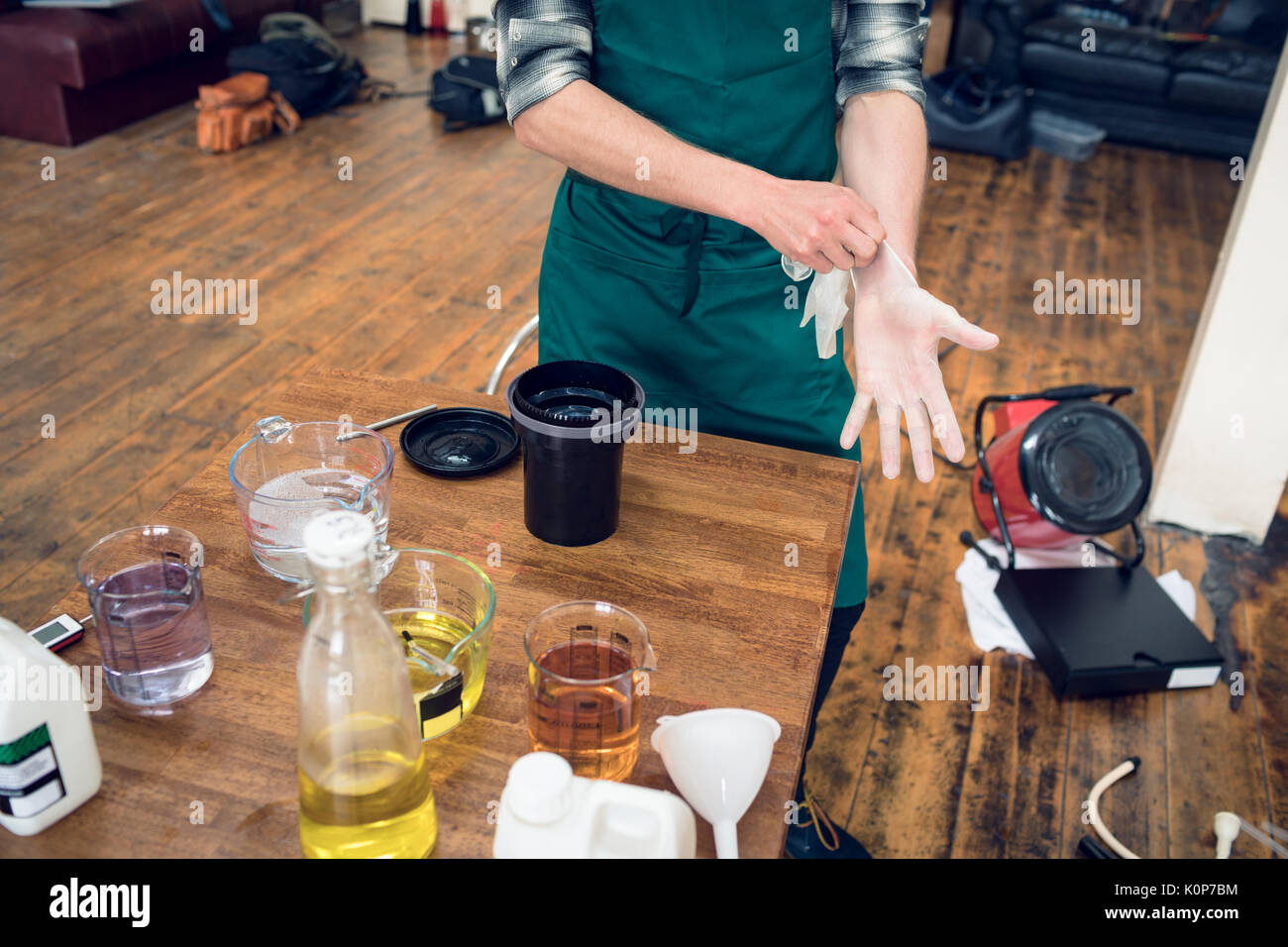 High angle view of photographer wearing protective gloves while working ...