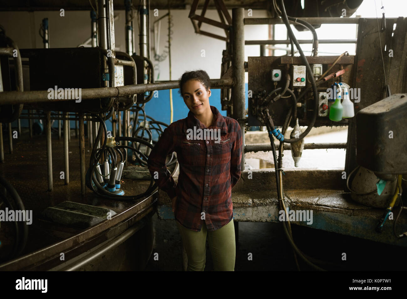 Portrait of confident woman standing in barn Stock Photo - Alamy
