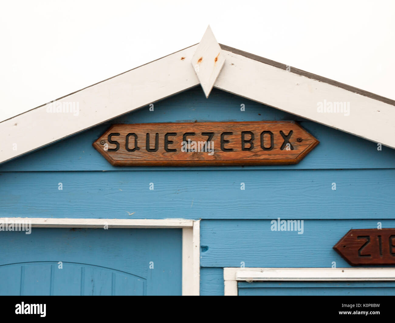 close up of wooden sign above hut squeeze box; England; UK Stock Photo ...