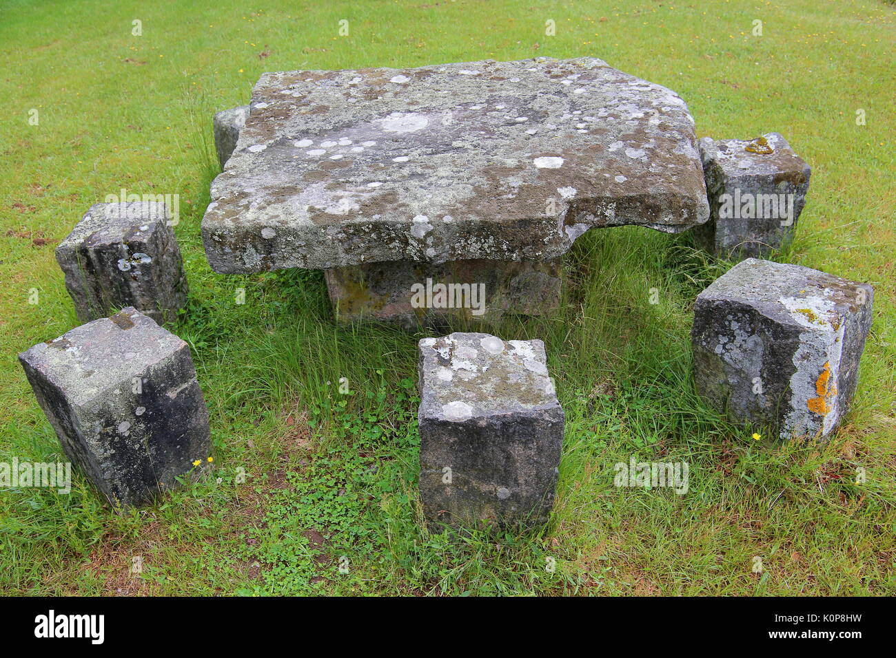 Stone table on a green grass ground Stock Photo - Alamy