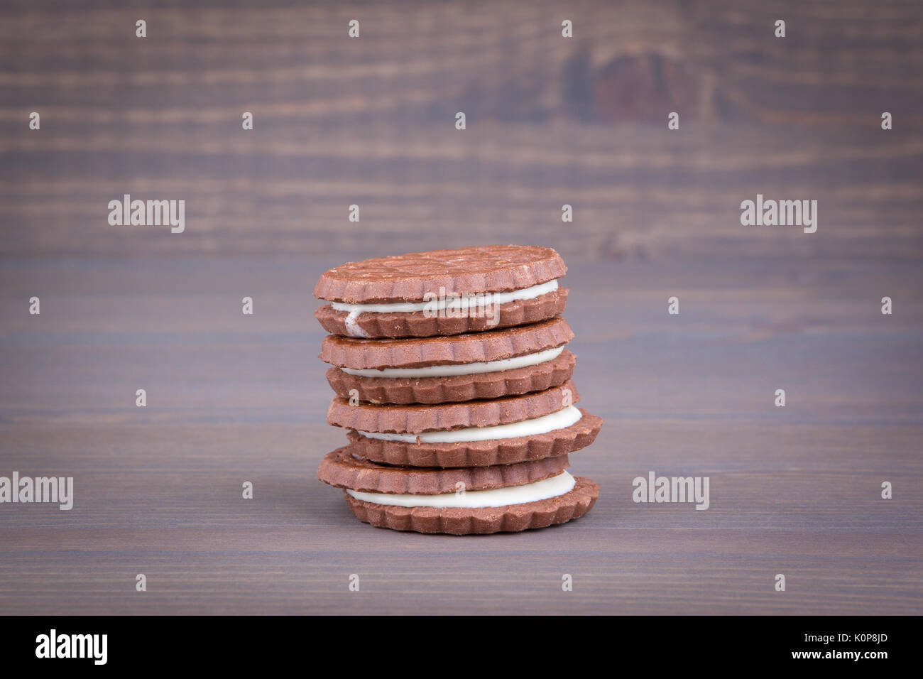 Biscuits with sweet filling on a wooden background Stock Photo - Alamy