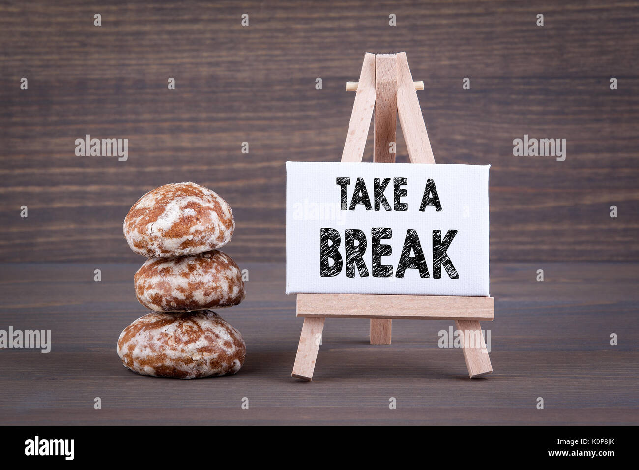 Take a break. Biscuits with sweet filling on a wooden background Stock ...