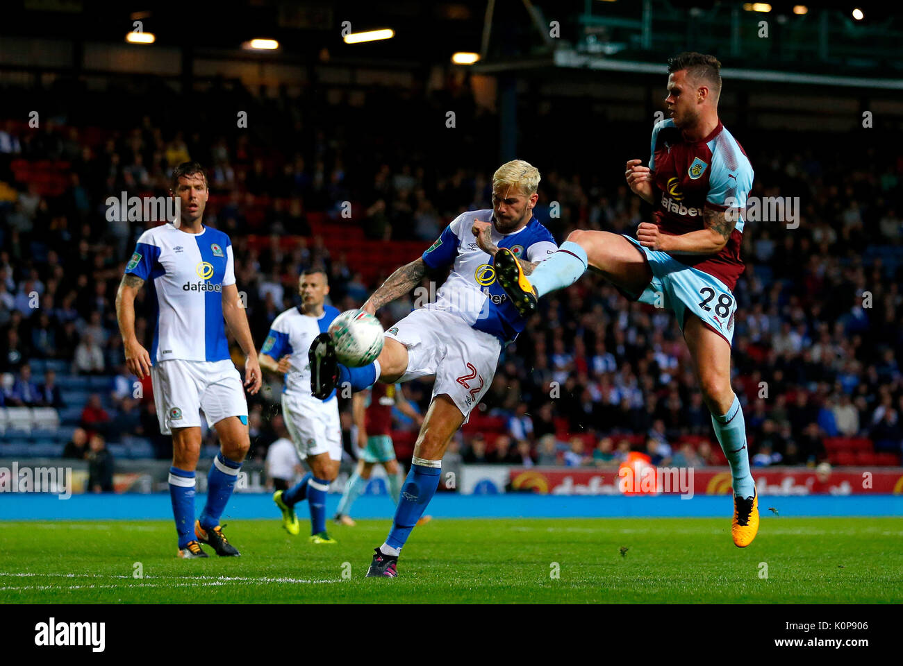 Blackburn's Ben Gladwin (left) in action with Burnley's Kevin Long ...