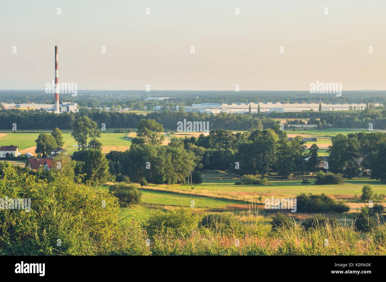 Summer countryside industrial landscape. Homes in the countryside and ...