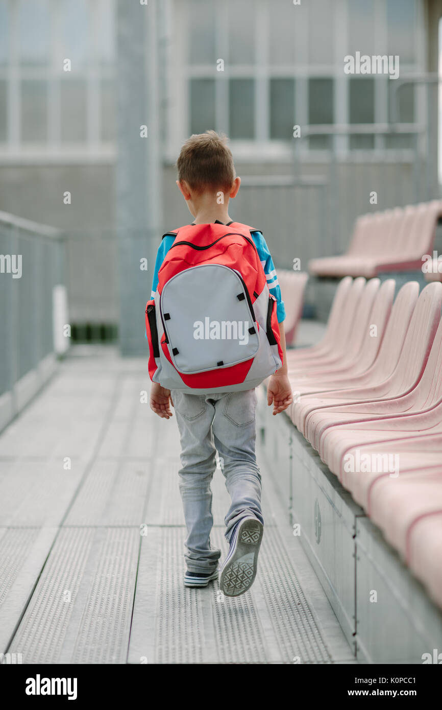 Rear view of a young school boy on his way to school Stock Photo - Alamy
