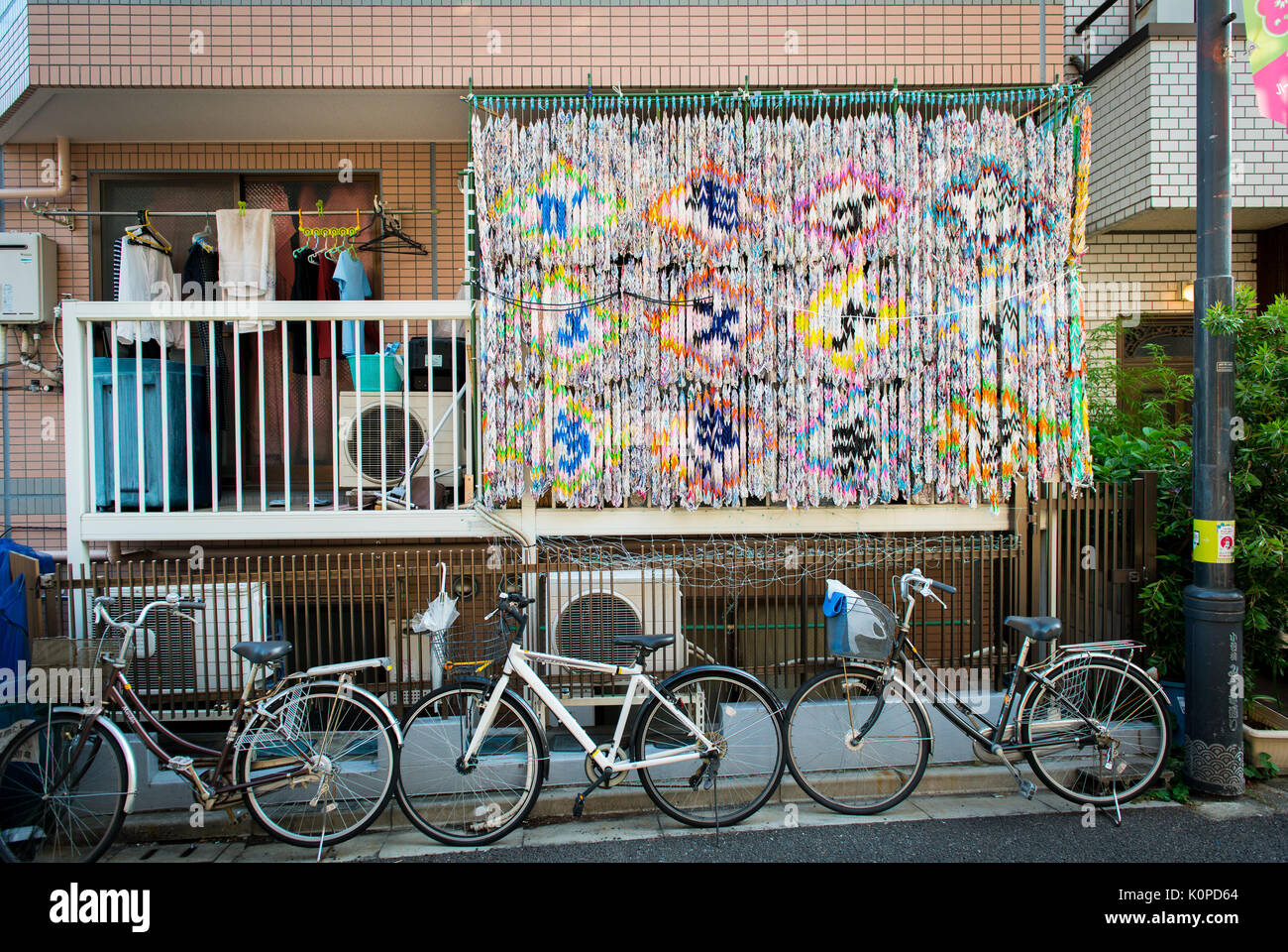 Multiple bikes parked in front of house in Tokyo Stock Photo - Alamy