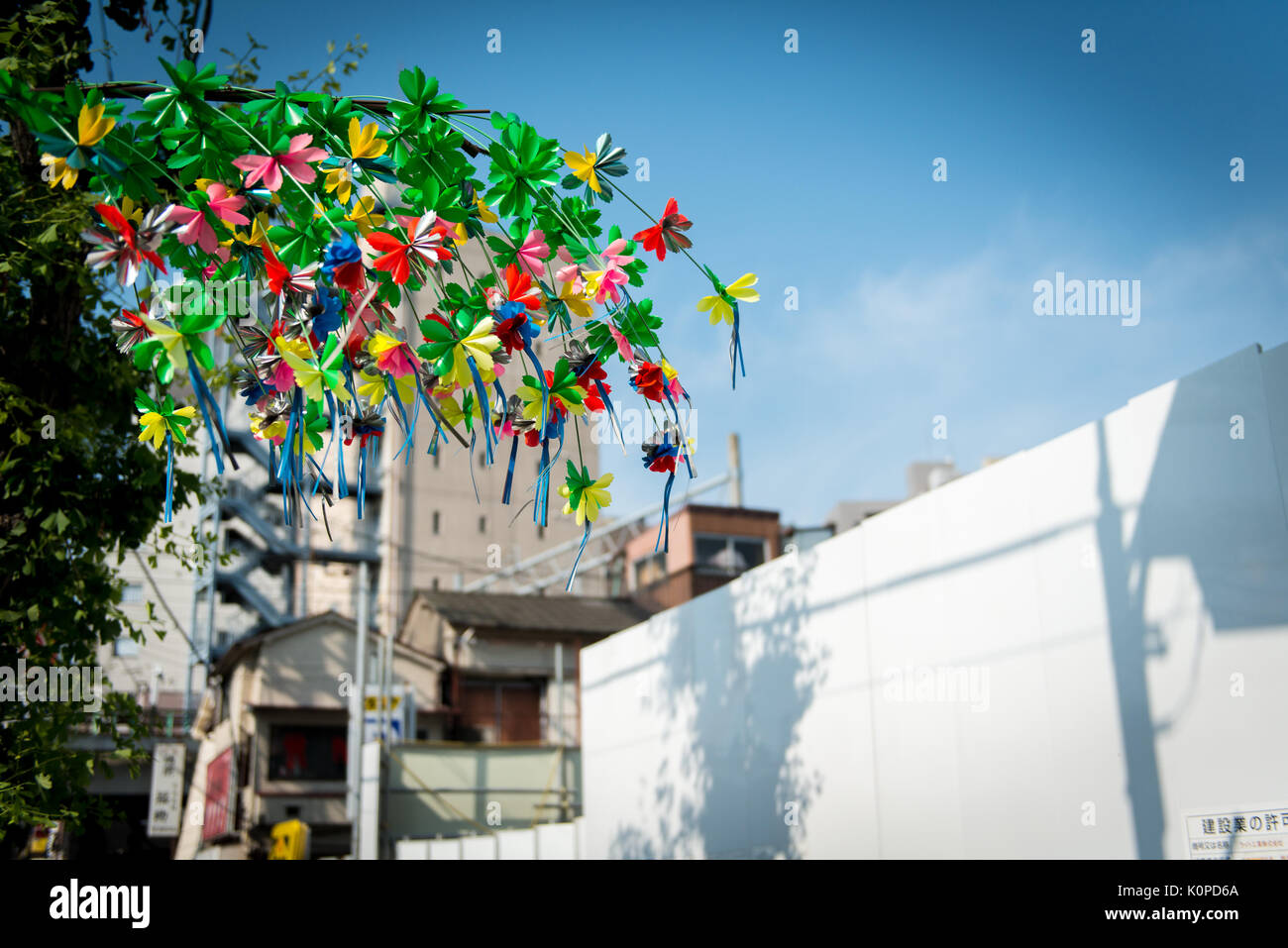 Plastic flower decorations hanging over the street in Tokyo Stock Photo ...