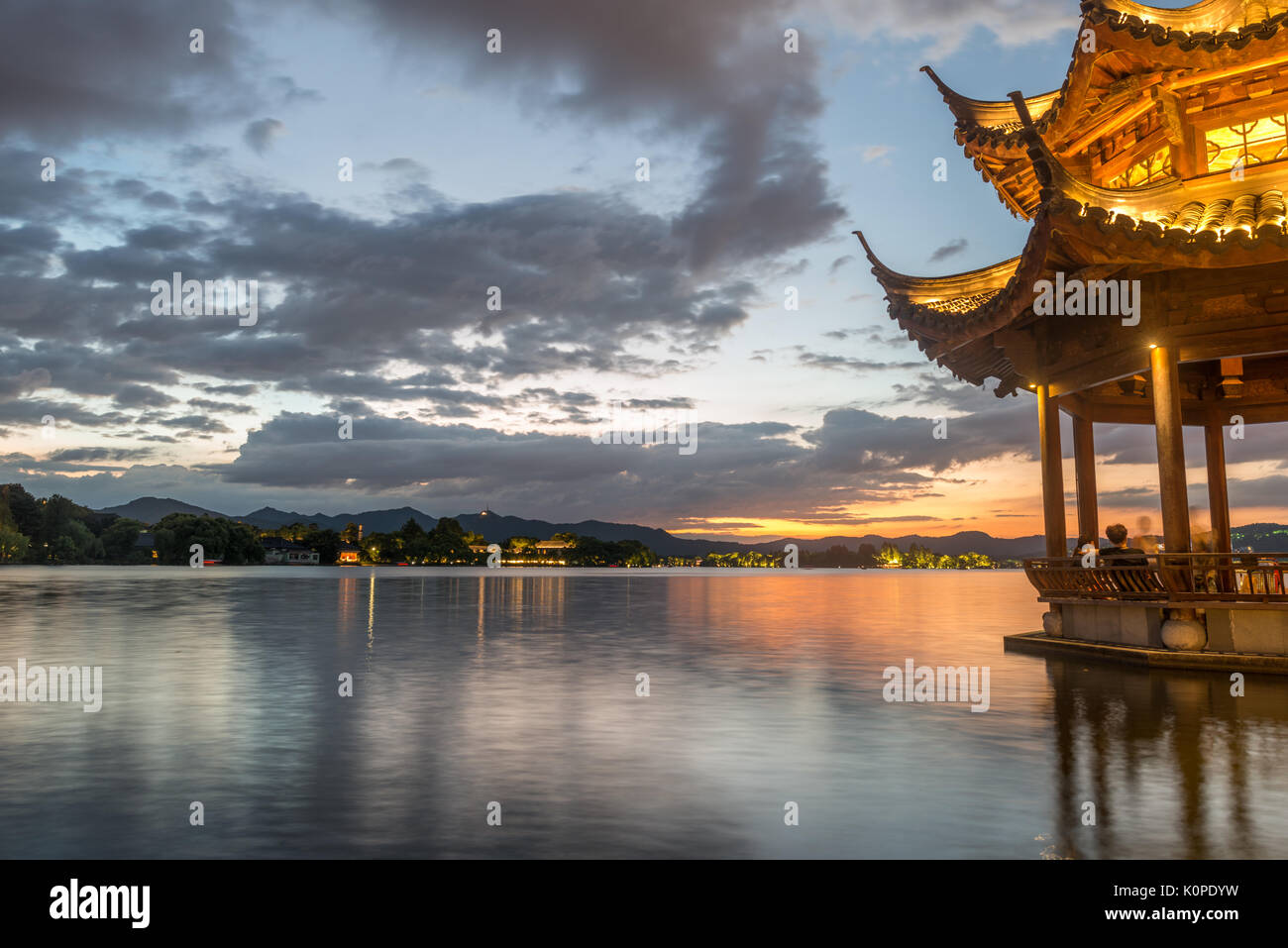 Chinese manual worker repairing the stone path, sidewalk in early ...