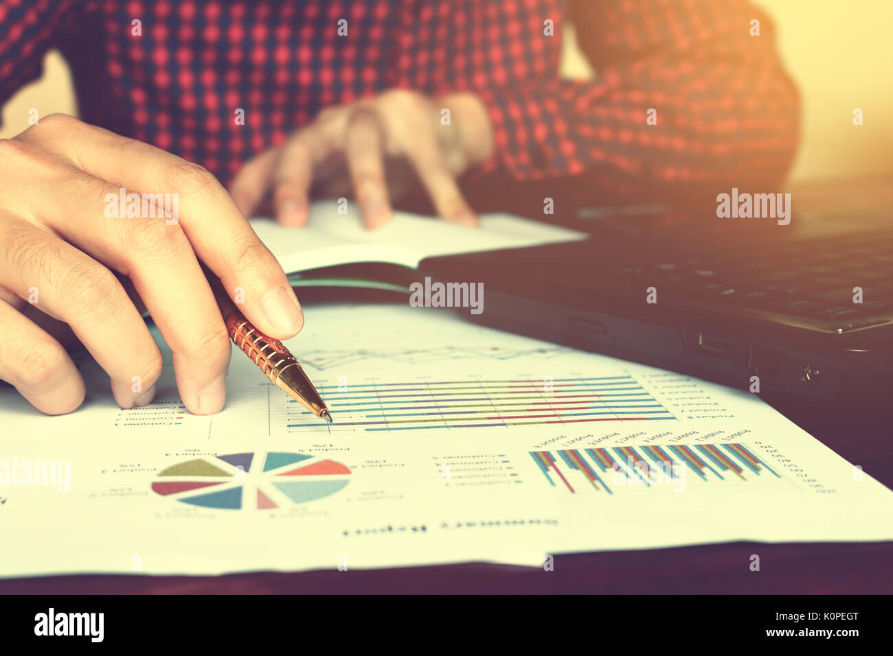 Close up businessman hand writing with calculating at home office Stock ...