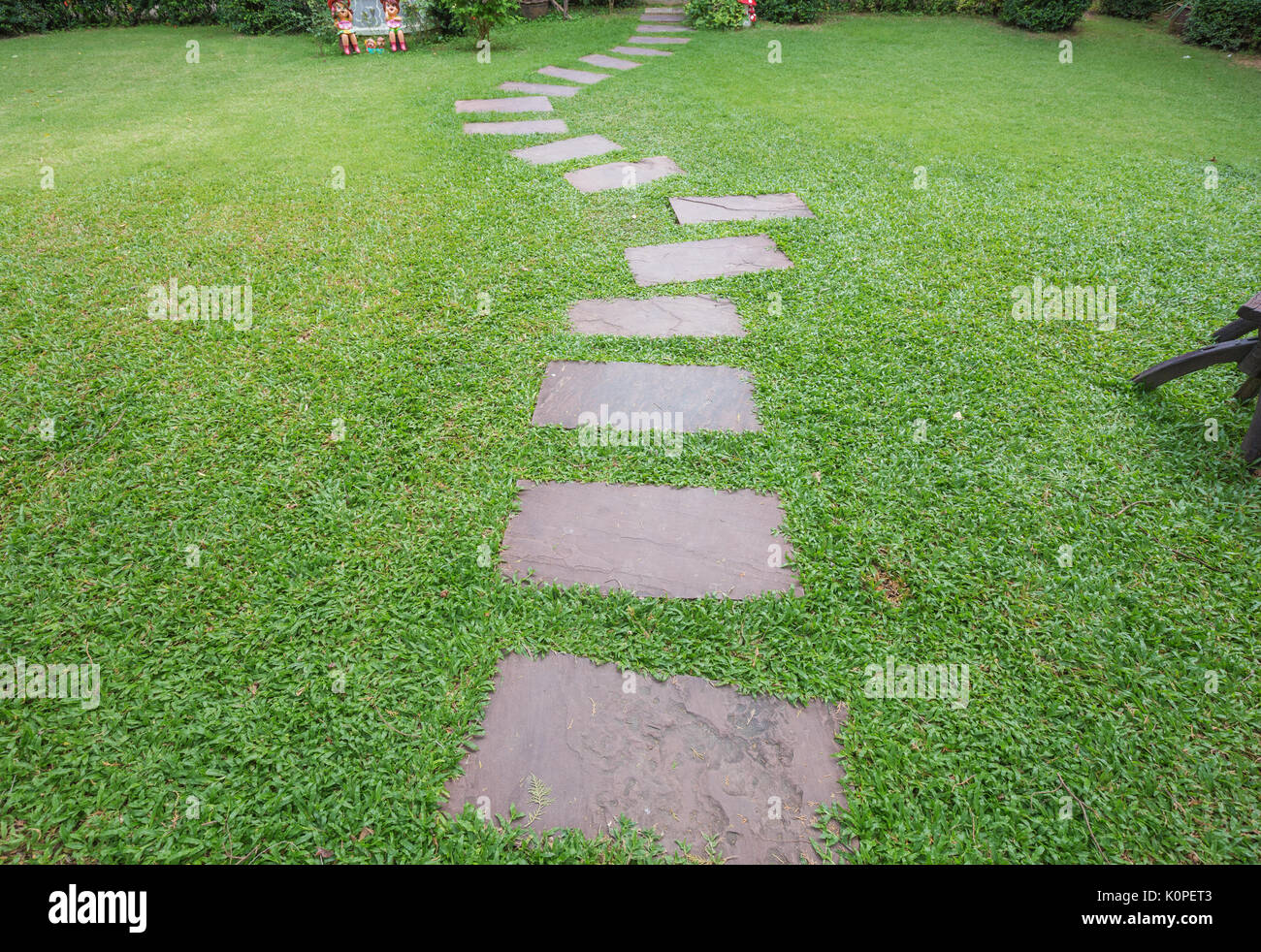 stone walk way between grass in the garden Stock Photo - Alamy