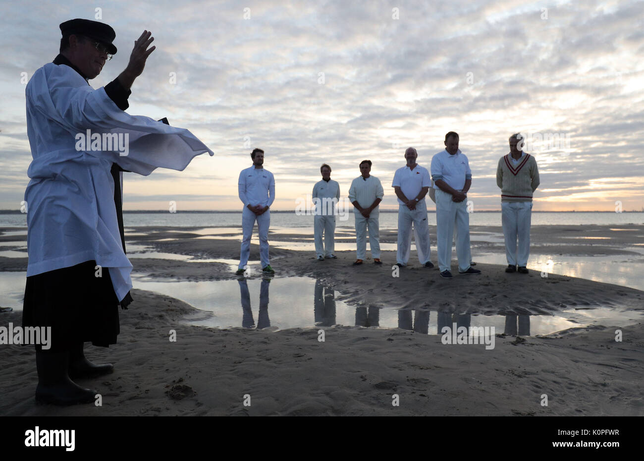 The pitch is blessed by a vicar during the annual Brambles cricket ...