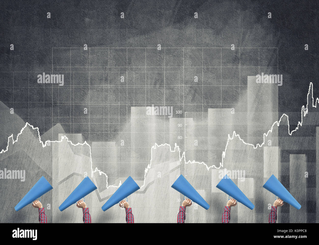 female hands in a row holding blue paper trumpets against graphs ...