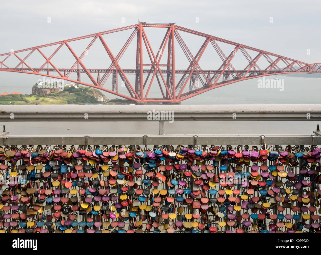 Section of bridge railing with mass of colourful love locks on walkway ...