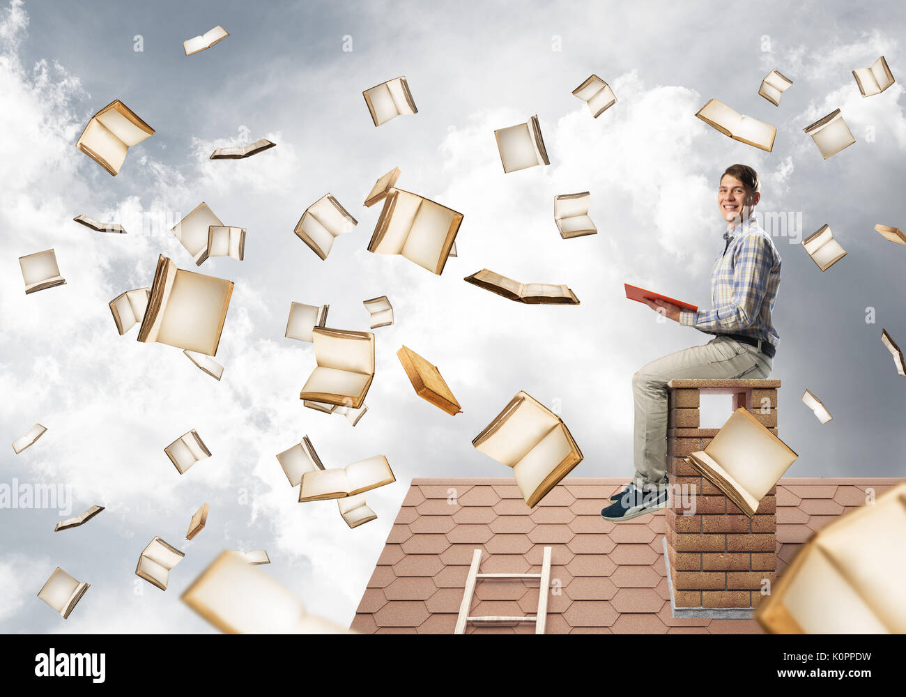Man reading book and many of them flying in air Stock Photo - Alamy