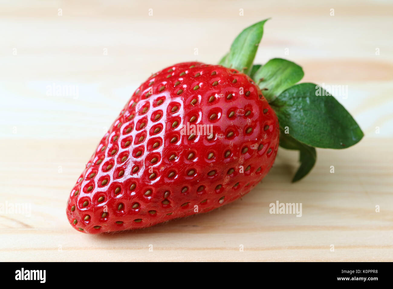 Closed up a Bright Color Fresh Ripe Strawberry Isolated on Wooden Table ...