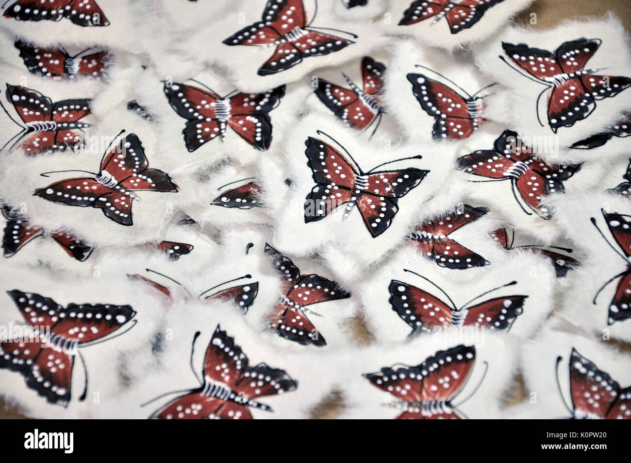 Paint a little butterfly on paper Stock Photo - Alamy