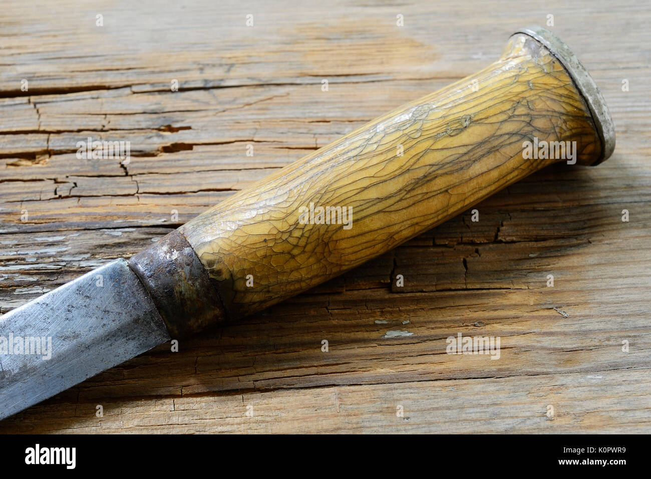 traditional Finnish knife puukko on a wooden background Stock Photo - Alamy