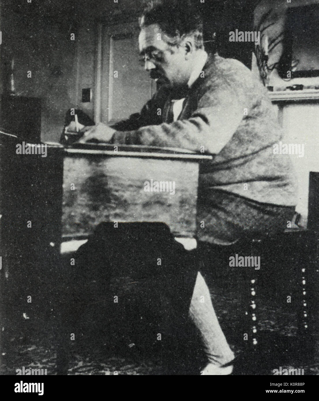 Frank Bridge composing at his desk. English composer 1879-1941 Stock ...